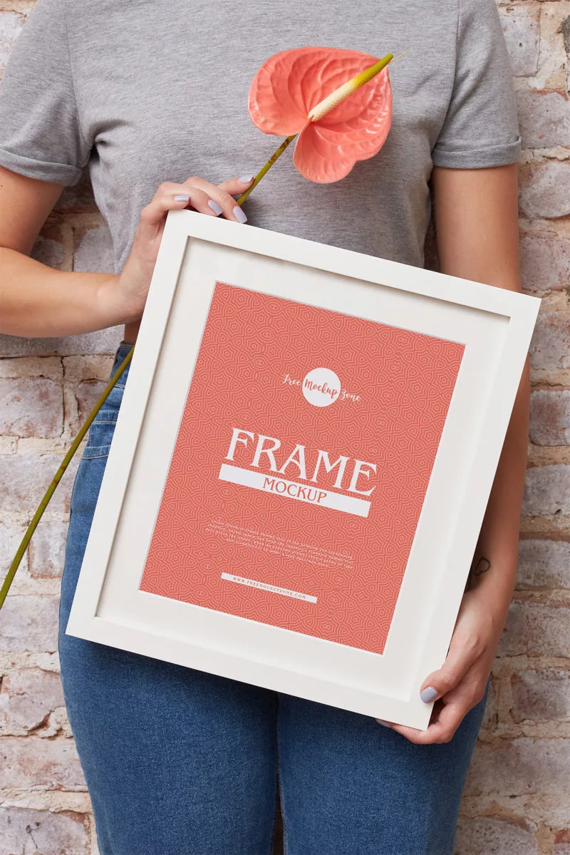 Girl Showing Photo Frame Design Mockup | The Free Mockup