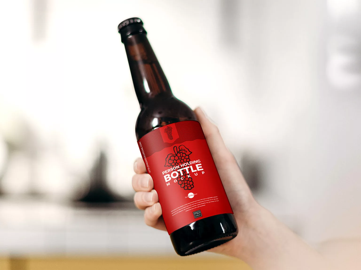 Beer Bottle Mockup in Hand | The Free Mockup