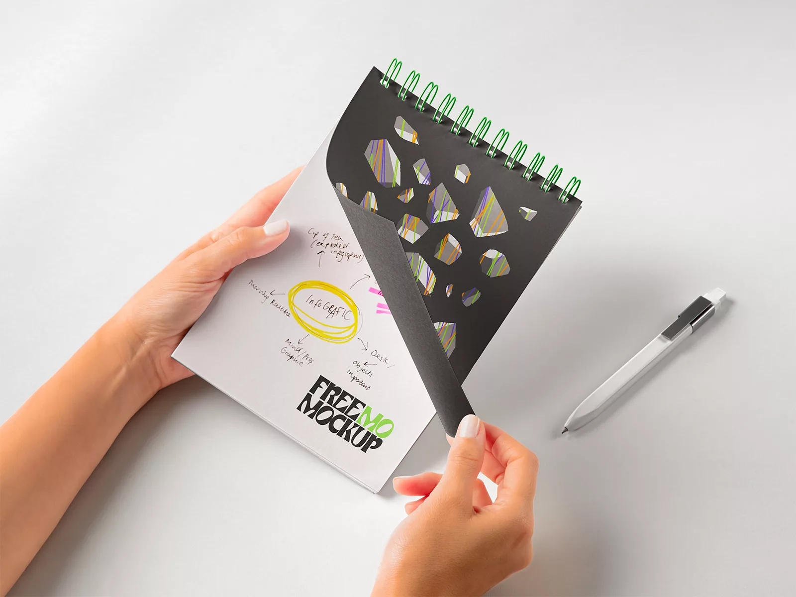 Hands Holding Spiral Notebook PSD Mockup | The Free Mockup
