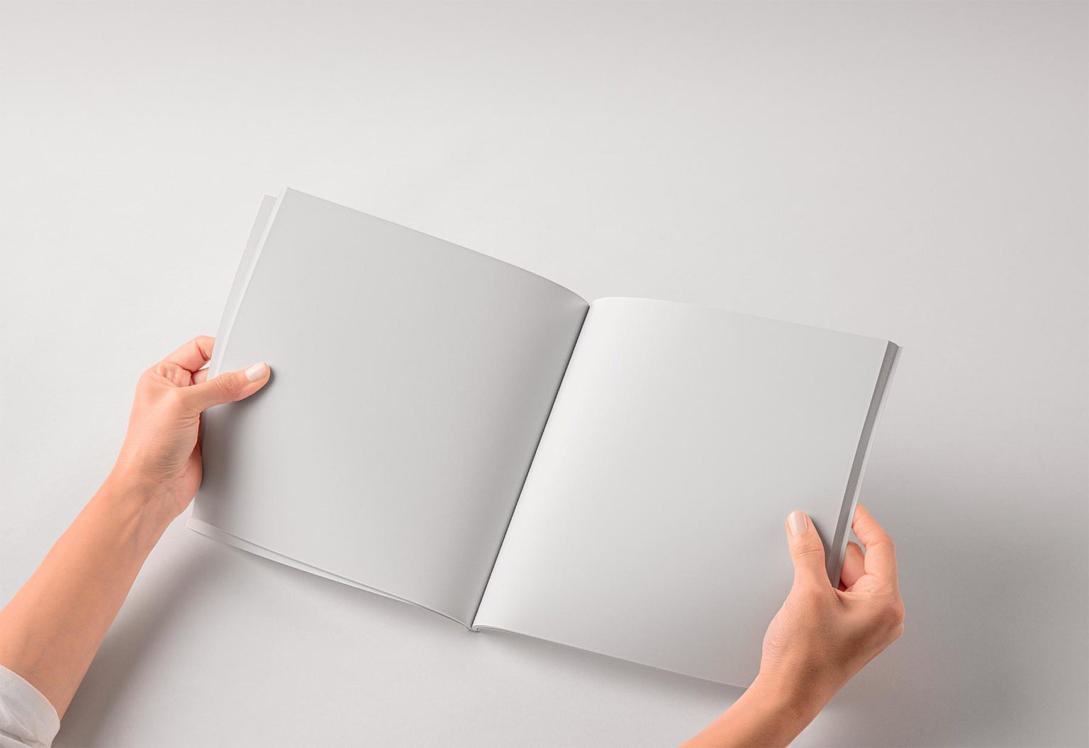 Open Square Catalog/Book Mockup in Hands | Free Mockup